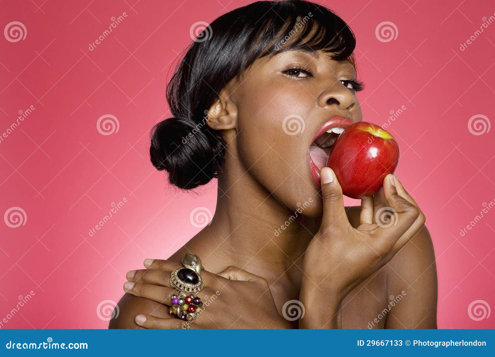 Close Up of Woman Taking a Bite of Apple Stock Image - Image of ...