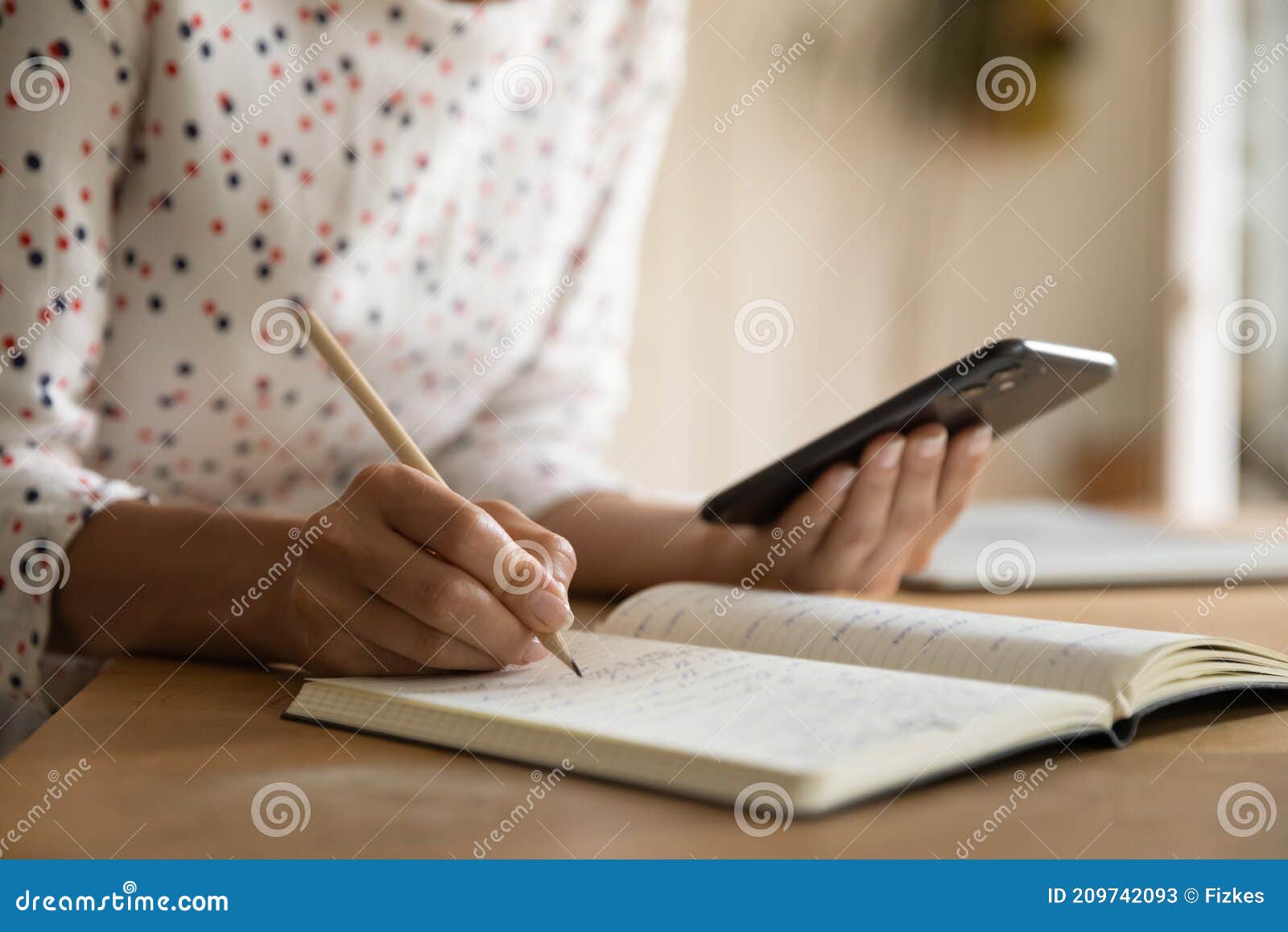 Close Up of Woman Use Cellphone Write in Notebook Stock Image - Image ...