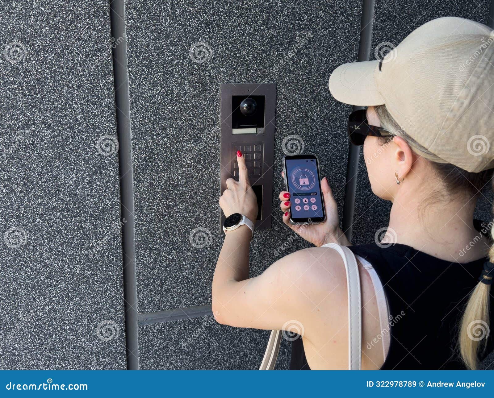 Close Up of Woman Using Intercom at Building Entrance. Stock Image ...