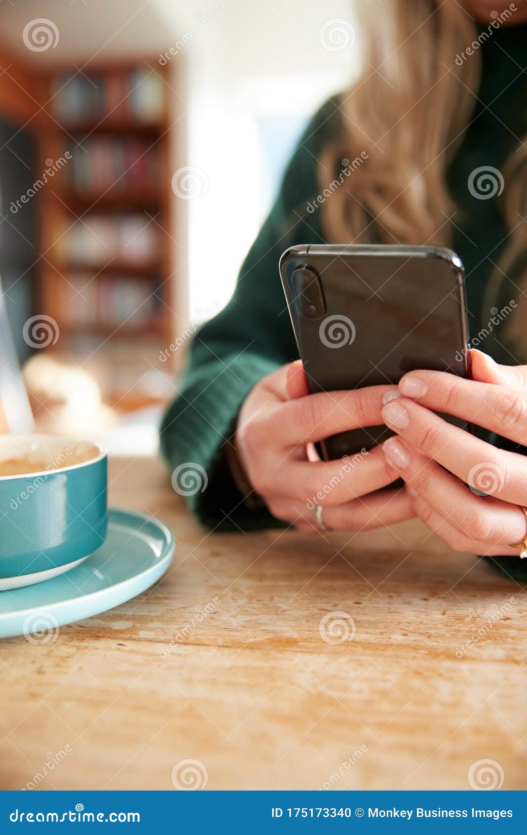 Close Up of Woman Using Mobile Phone Sitting at Table in Cafe Stock ...