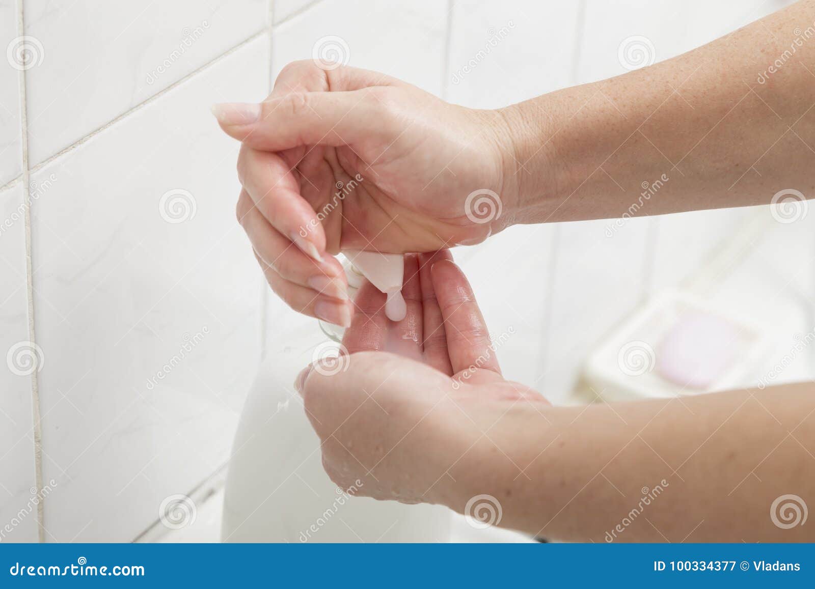 Using liquid soap stock image. Image of healthy, close - 100334377