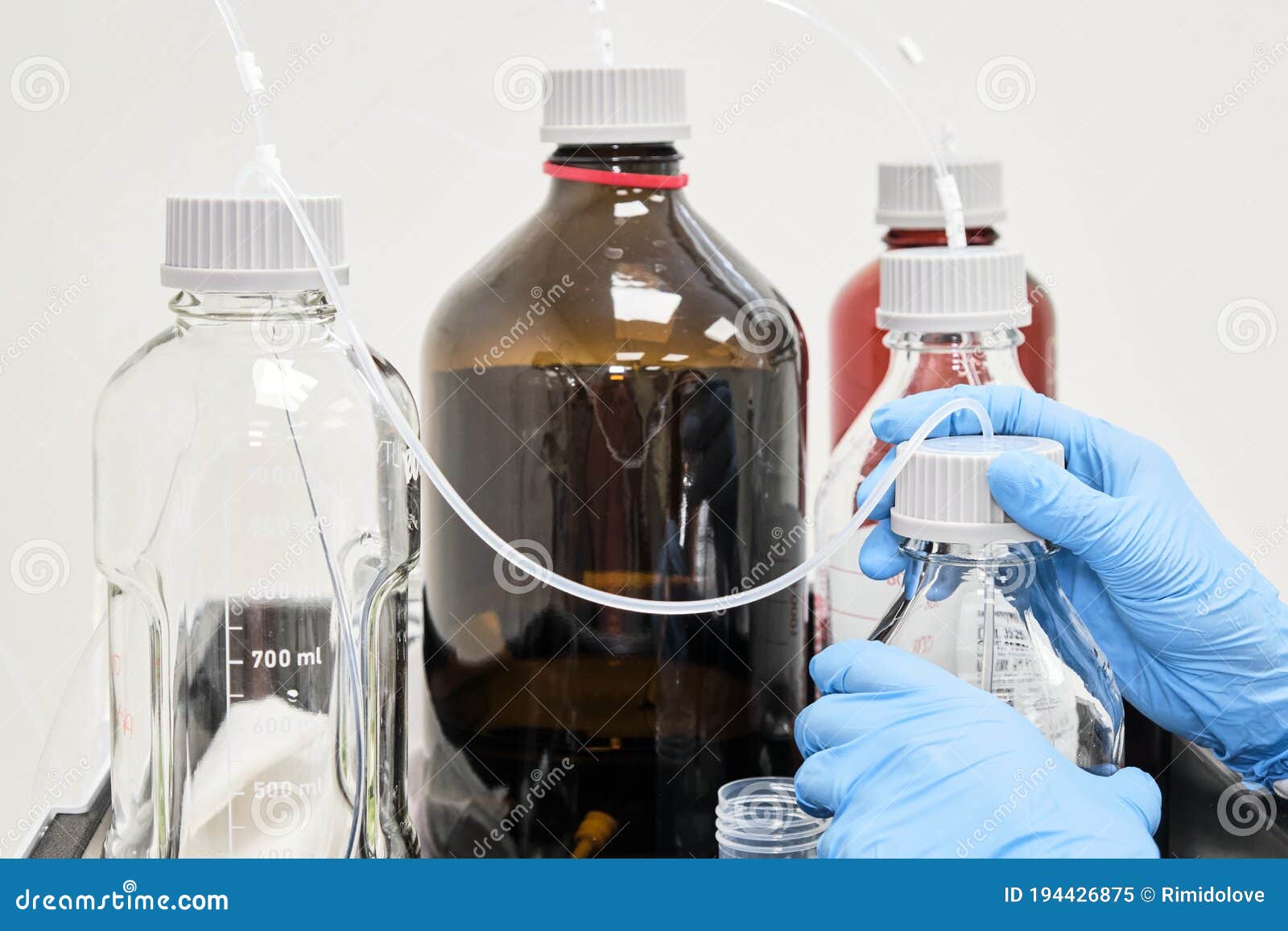 Close Up Womans Hand Changing a Mobile Phase Solution in HPLC System ...