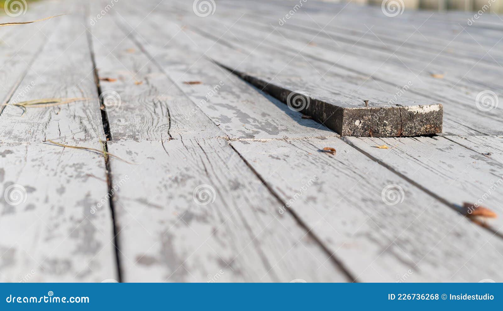 Close-up of a Wooden Floor with a Sticking Out Board. Stock Photo ...