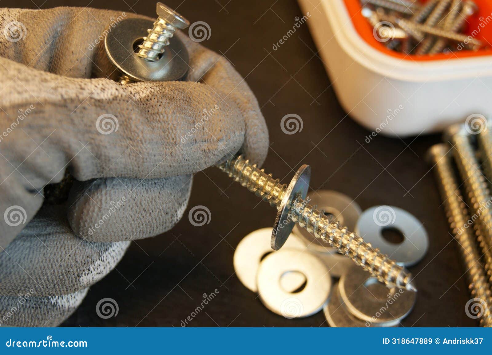 A Washer on a Large in a Builder S Hand. a Close-up of the Work Process ...