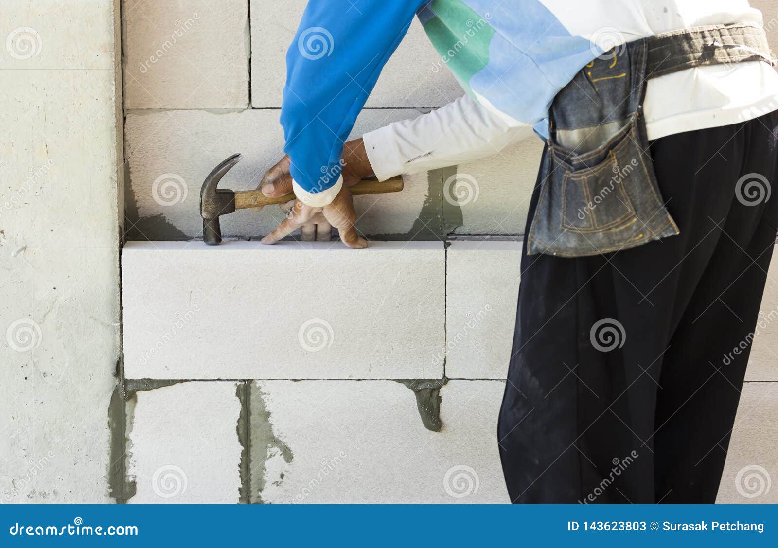 Close Up Worker Bricklayer Install Brick and Adjust with Hammer Stock ...