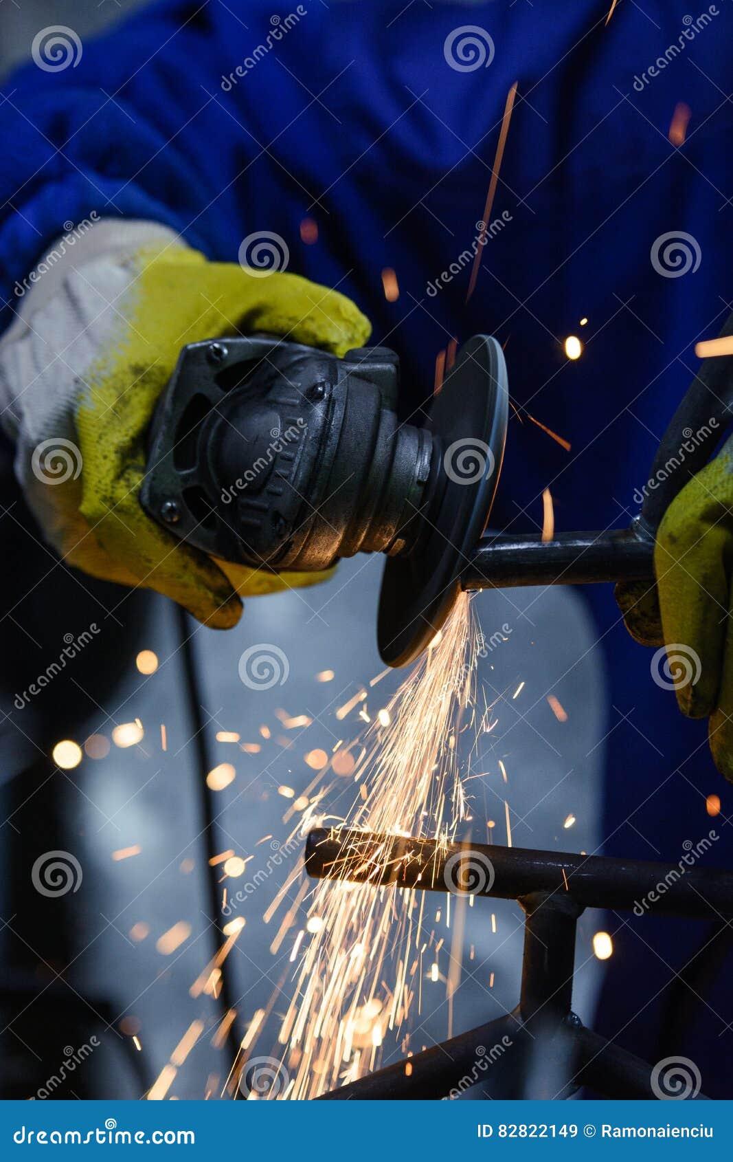 Close-up of Worker Cutting Metal with Grinder. Sparks while Grinding ...