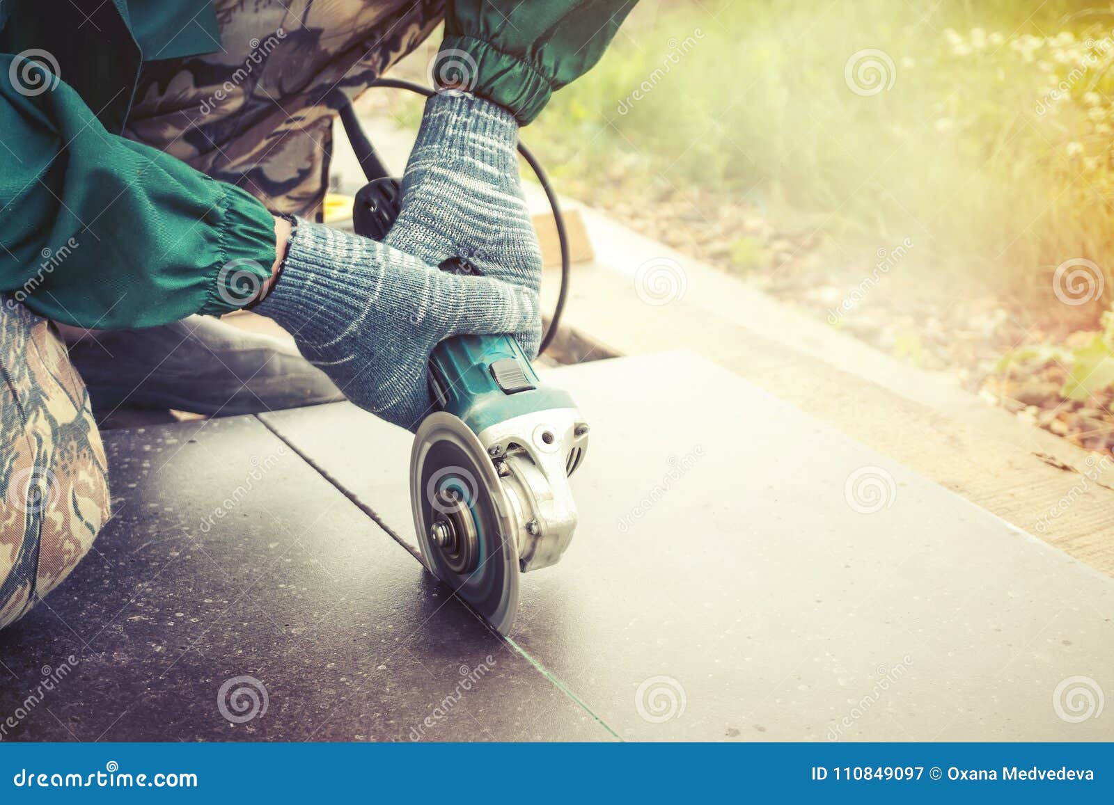 Close-up of Worker Cutting Stone with Grinder. Dust while Grinding ...