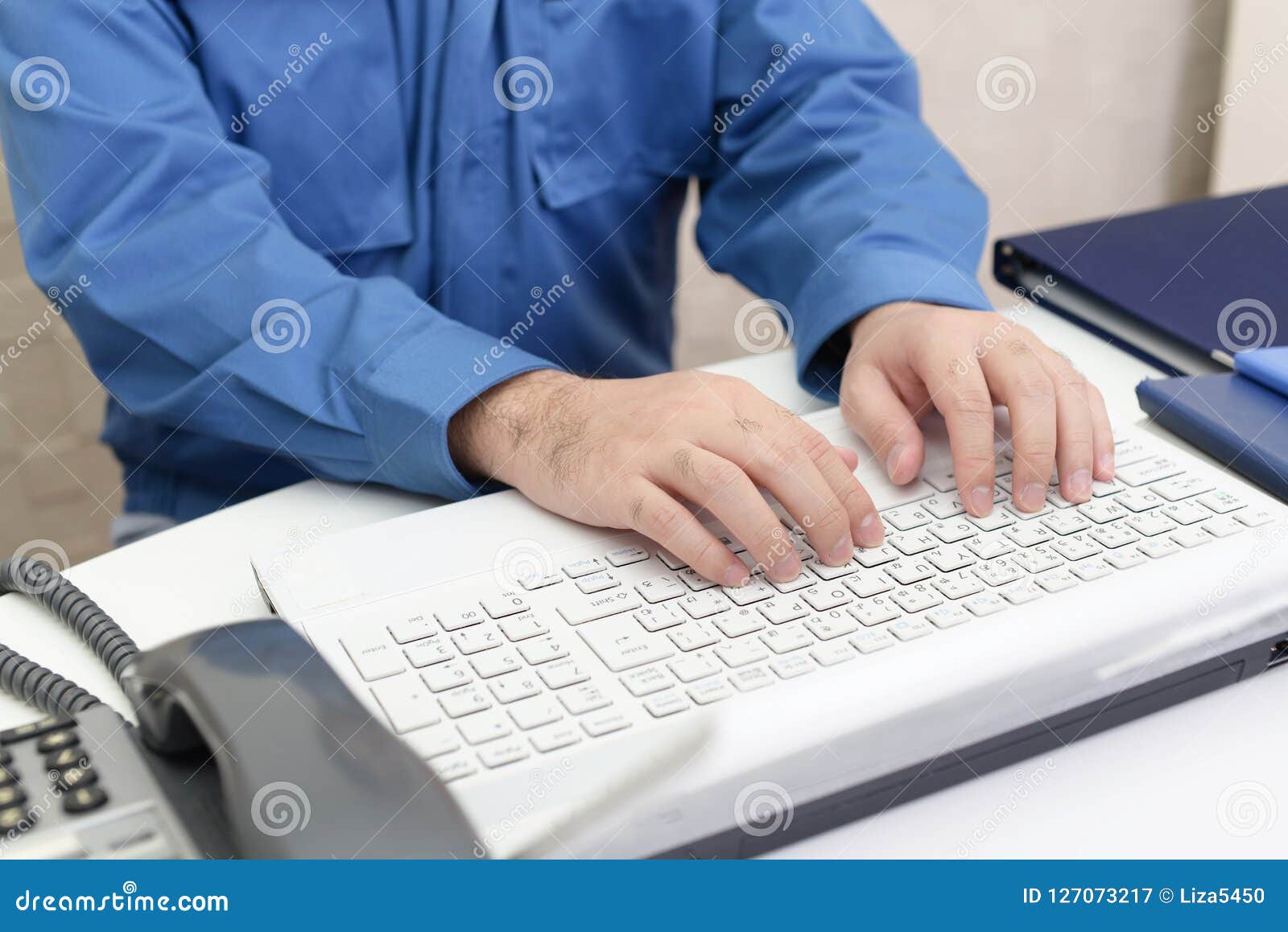 Worker using a laptop stock image. Image of isolated - 127073217