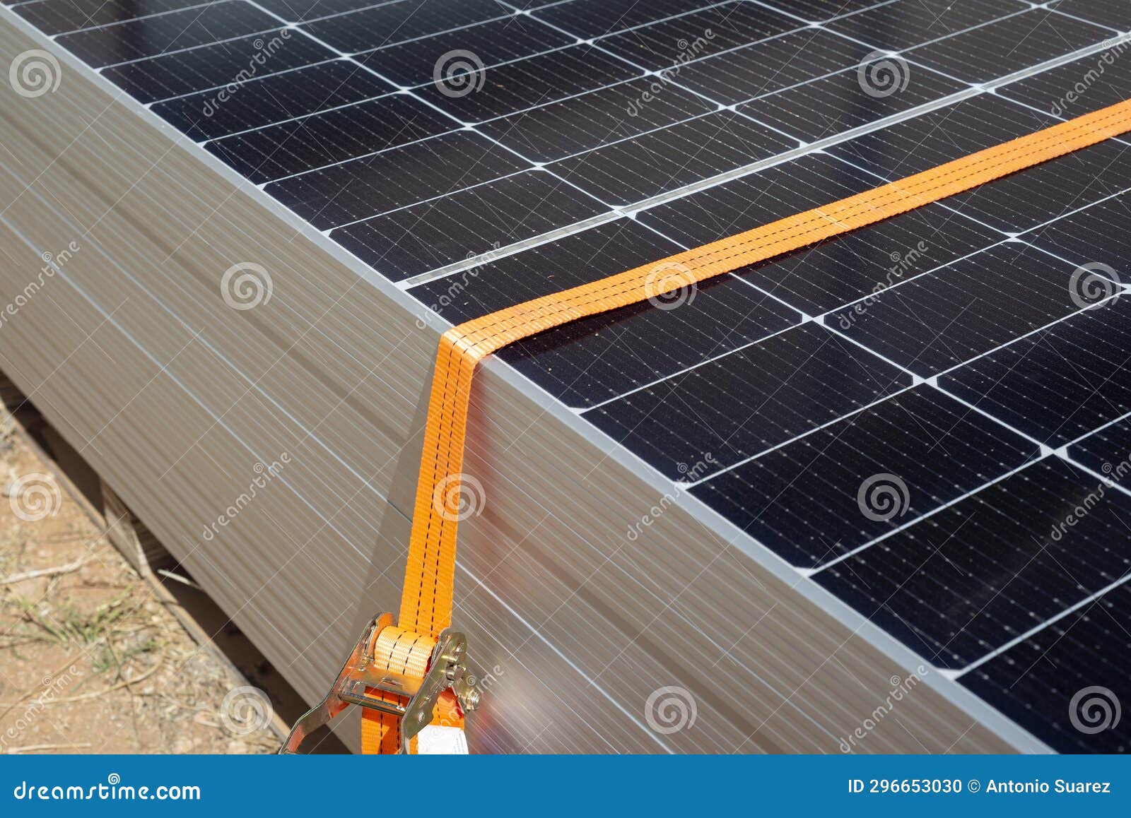 Close-up of a Worker S Hands Tying a Stack of Solar Panels with Orange ...