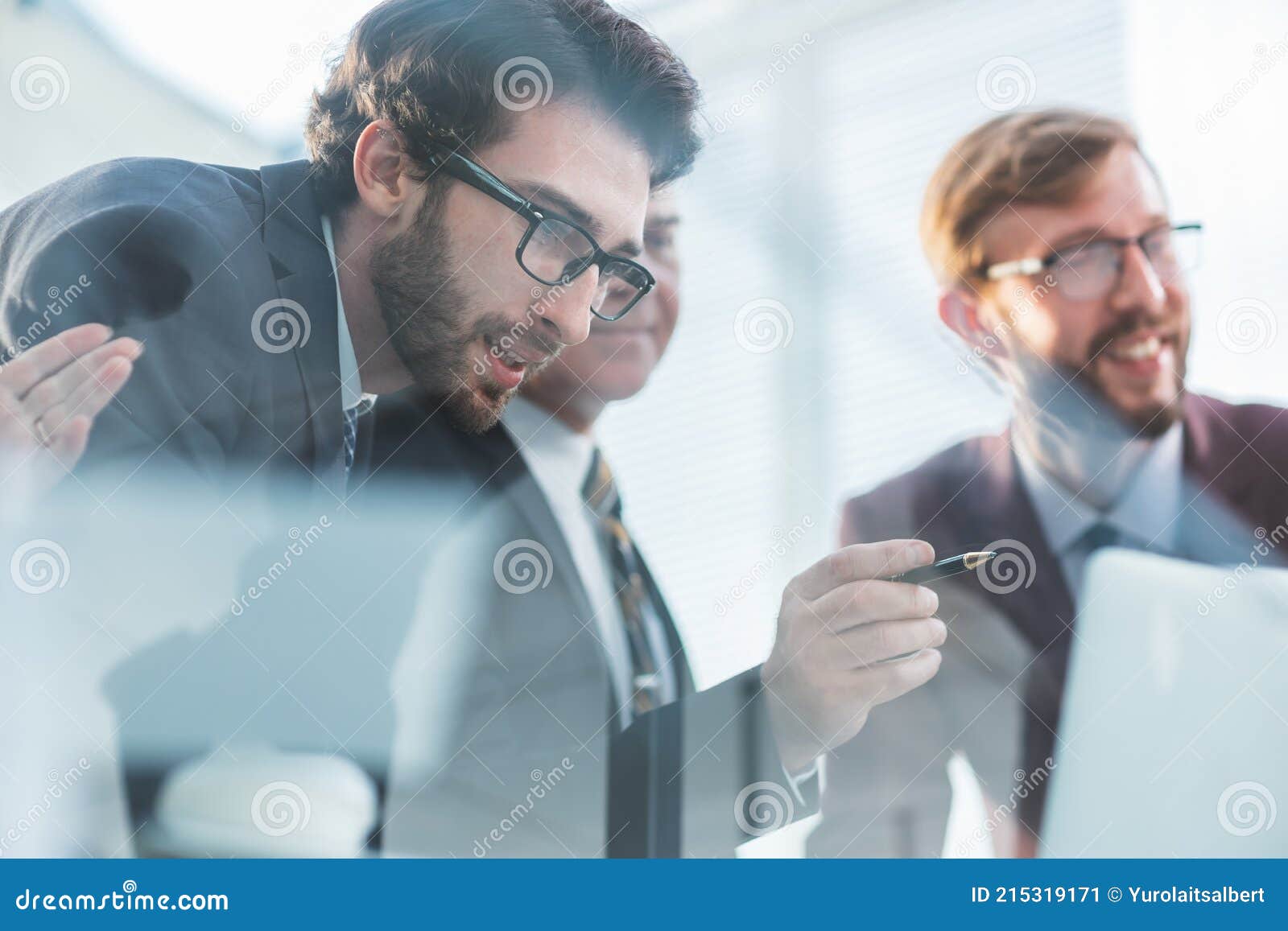 Close Up. Working Group Looking at the Monitors of Office Computers ...