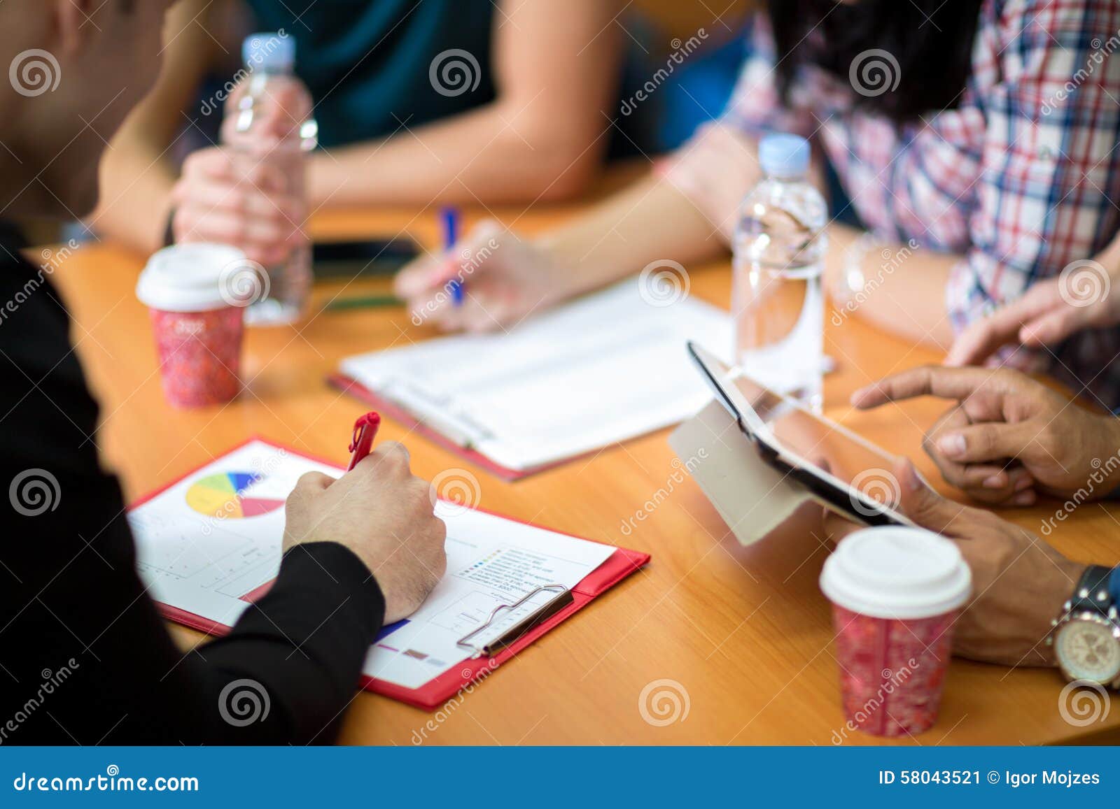 Close Up of Working Hands with Paperwork and Tablet Stock Image - Image ...