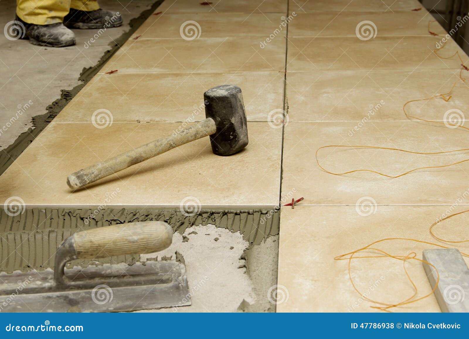 Close Up of a Workman S Tools on a Floor that is Being Tiled. Stock ...