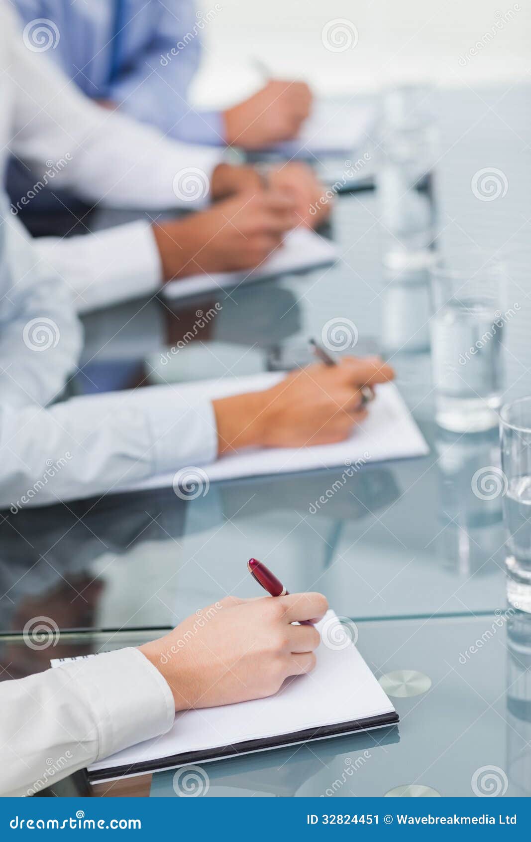 Close Up on Workmates Taking Notes during Presentation Stock Image ...