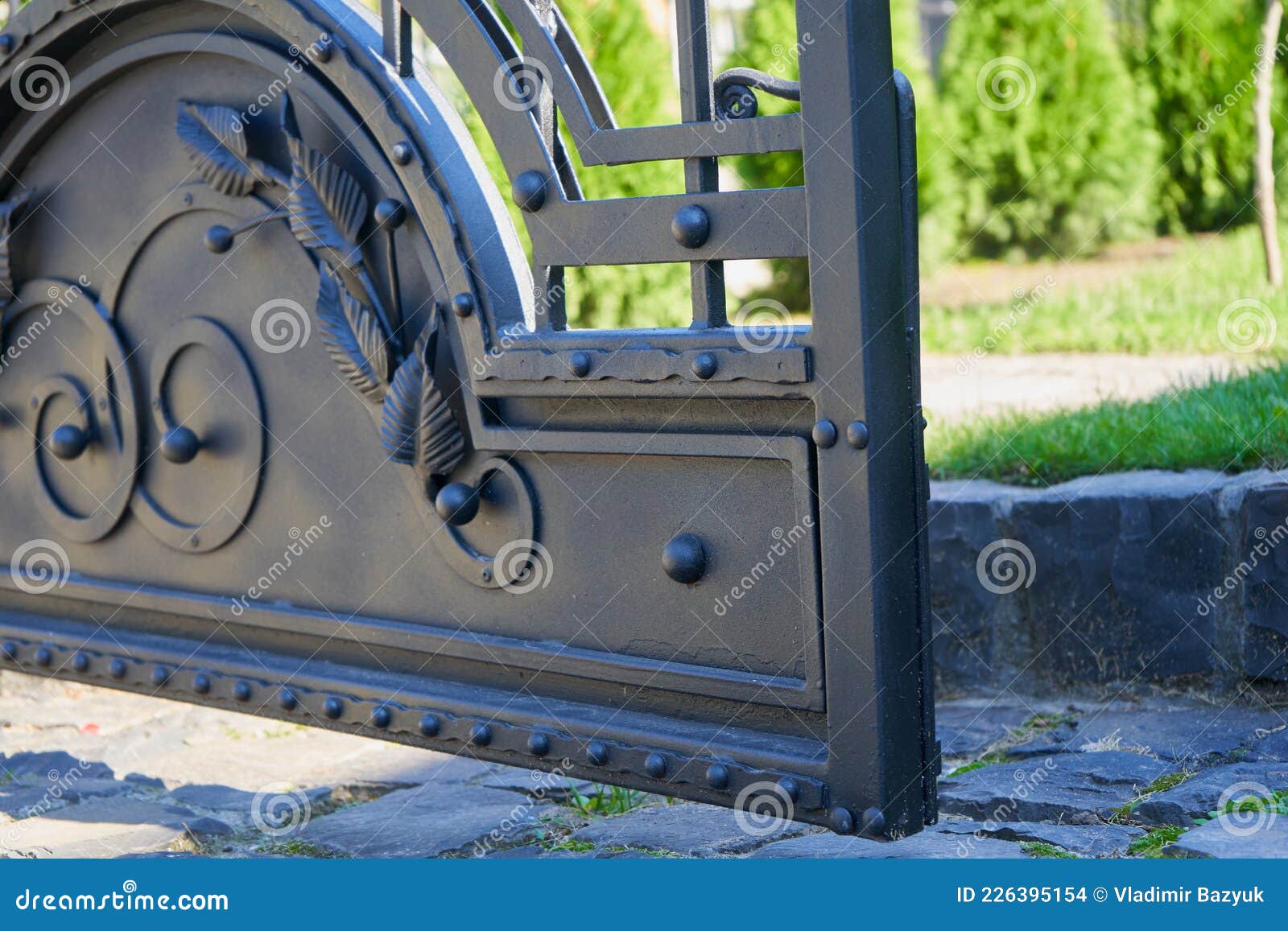 Close Up of Wrought Iron Gate on the Pavement,large Gate Open in the ...