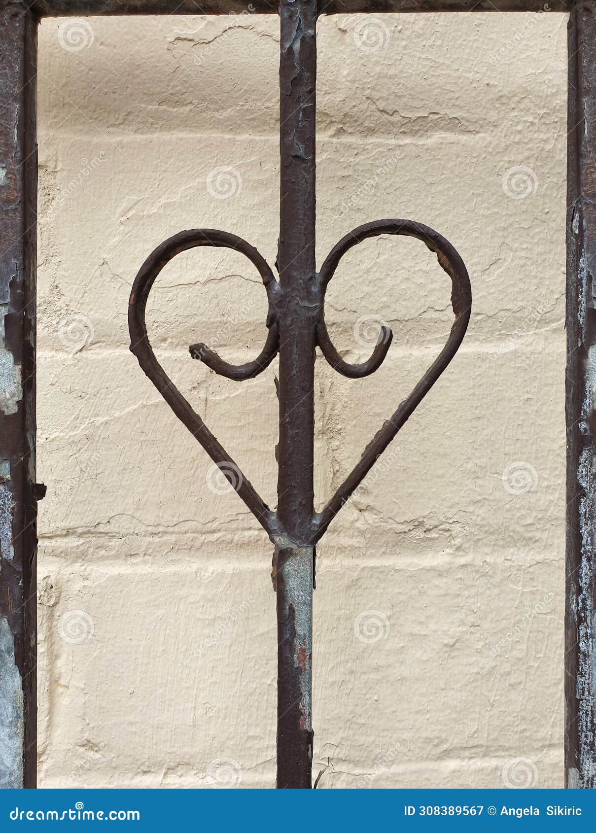 Close Up of Wrought Iron Heart Shape Against Brick Wall Stock Image ...