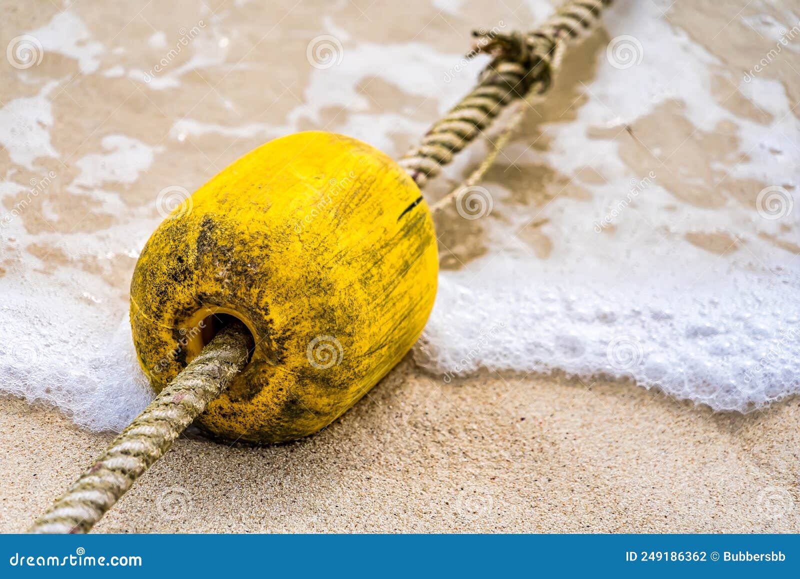 Close Up Yellow Buoys with Rope on the Beach Stock Photo - Image of ...