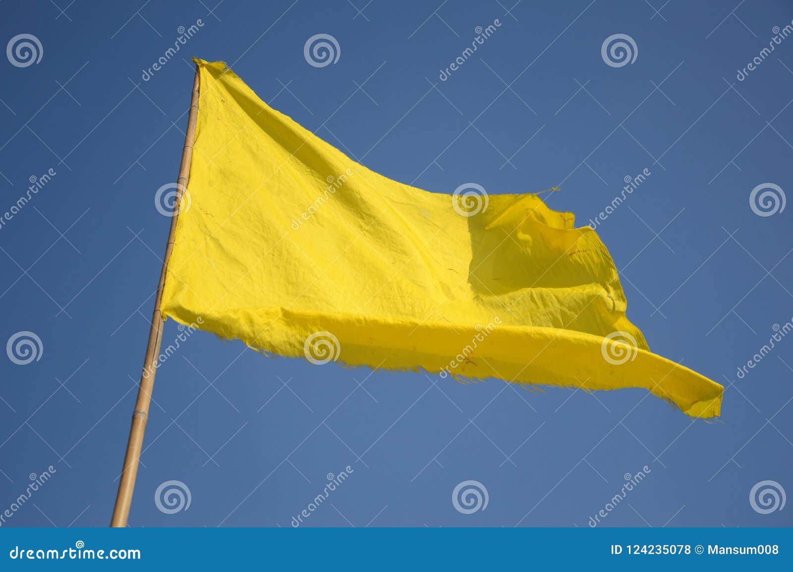 Yellow flag on blue sky stock photo. Image of close - 124235078