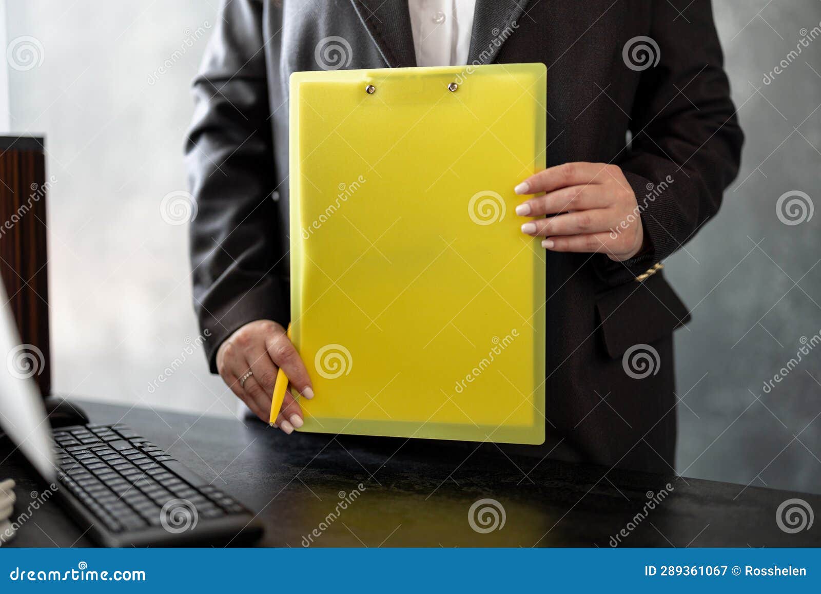 Close-up of Yellow Folder at the Reception Desk Stock Image - Image of ...