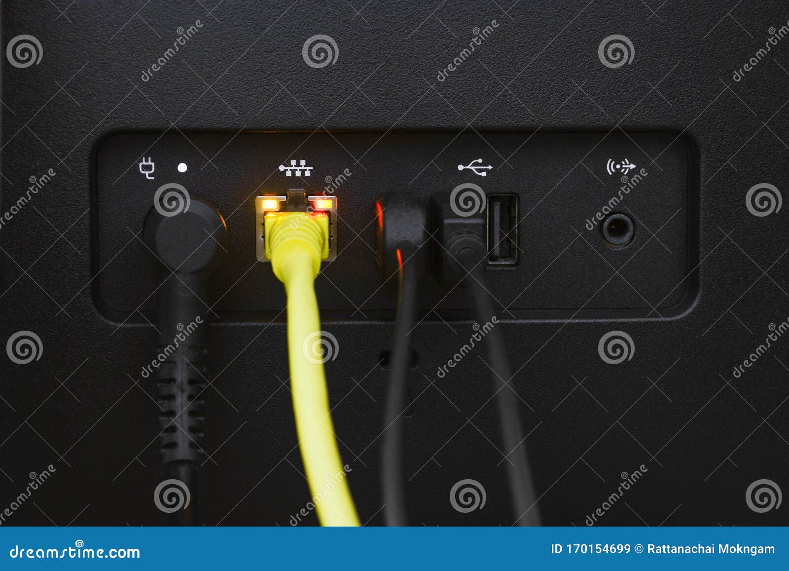 Close Up Yellow LAN or Network Cable Connected To a LAN Port of ...