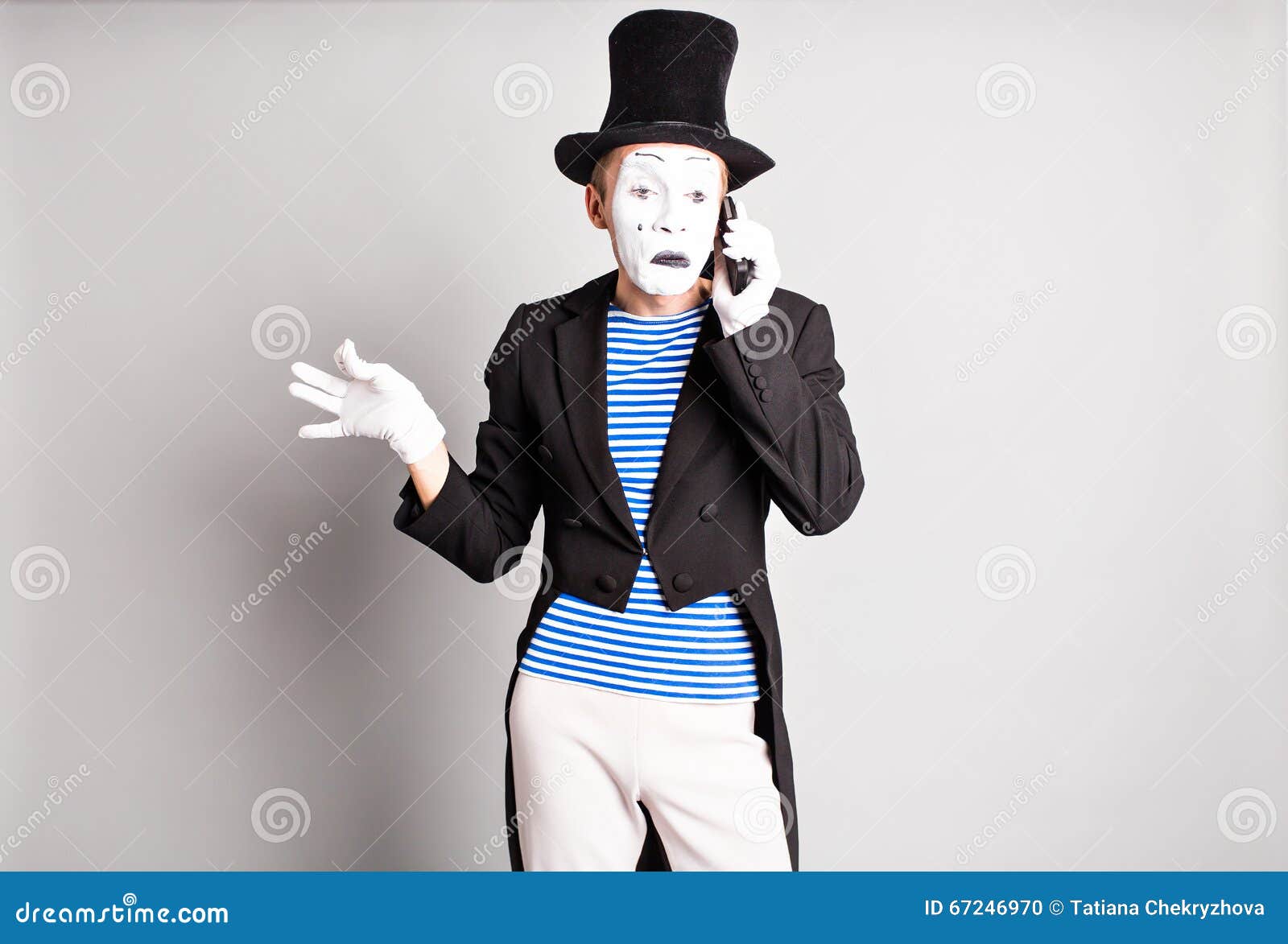 Close-up of a Young Actor Man Talking on Cell Phone at the Gray ...