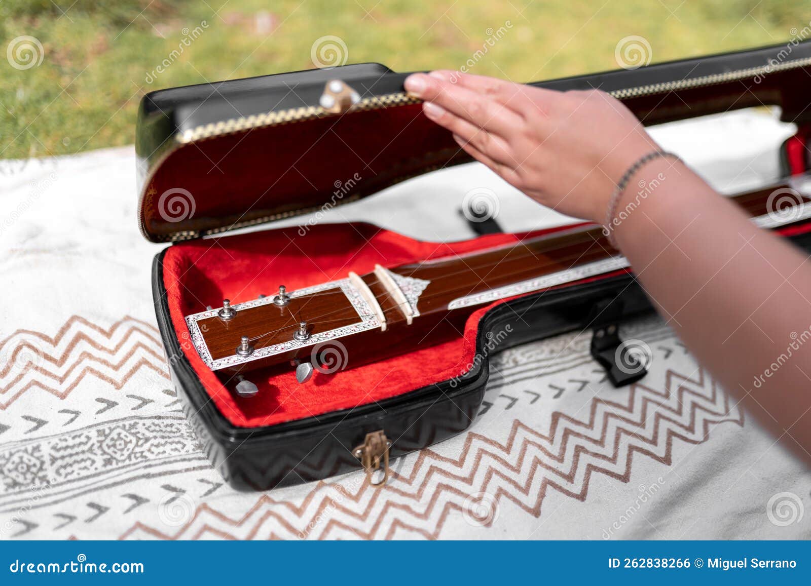 Close Up of a Young Adult Woman is Opening Her Indian Tanpura Suitcase ... Close Up of a Young Adult Woman is Opening Her Indian Tanpura Suitcase ...