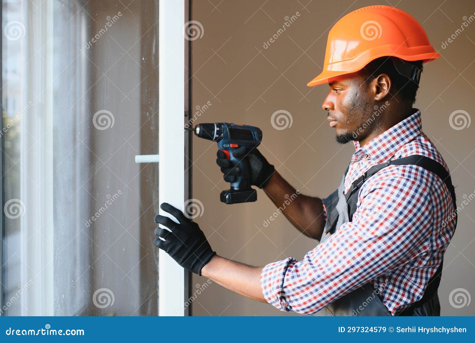 Close-up of Young African Handyman in Uniform Installing Window Stock ...