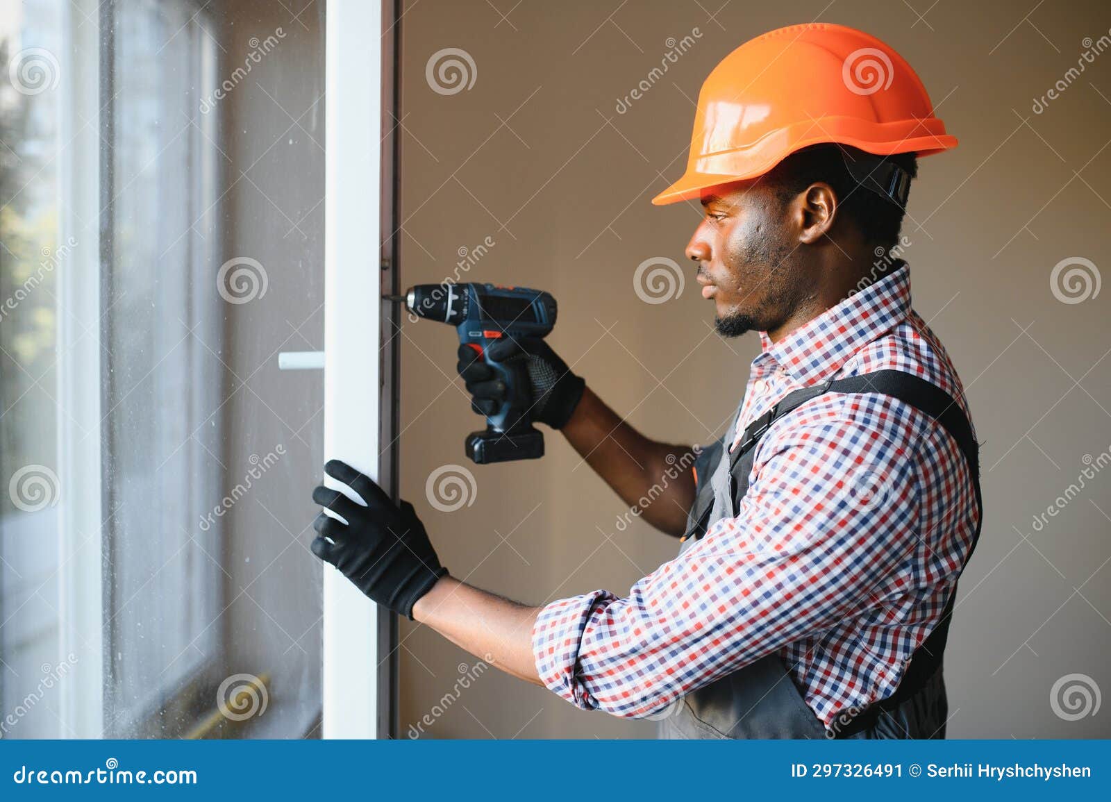 Close-up of Young African Handyman in Uniform Installing Window Stock ...