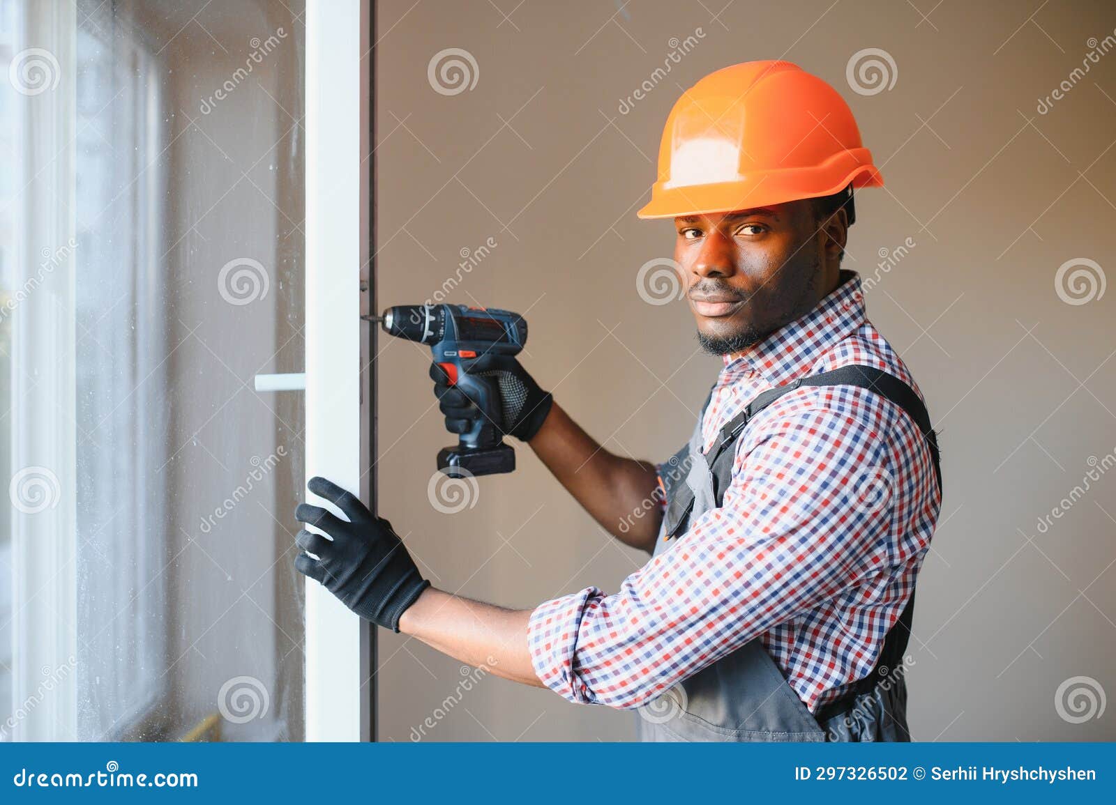 Close-up of Young African Handyman in Uniform Installing Window Stock ...