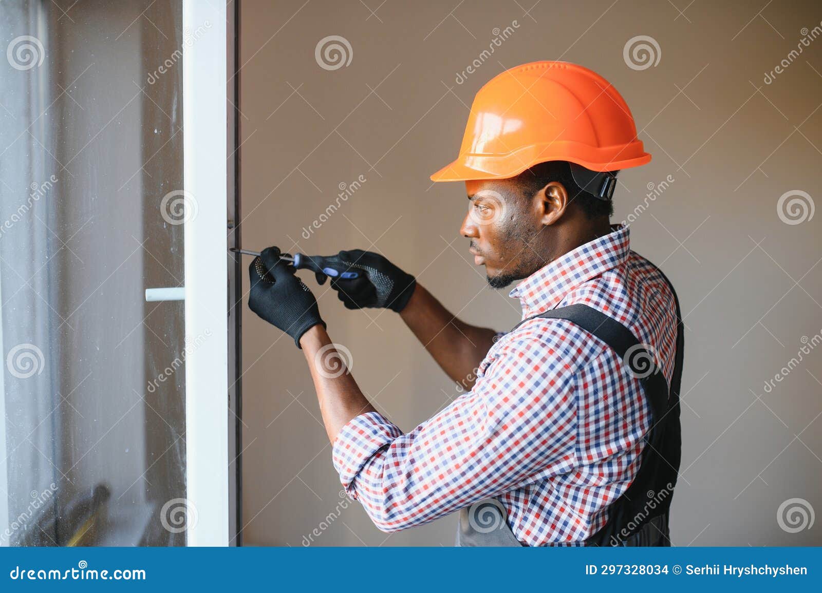 Close-up of Young African Handyman in Uniform Installing Window Stock ...