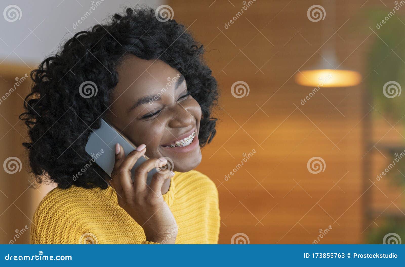 Close Up Of Young Afro Woman Talking By Modern Smartphone Stock Image