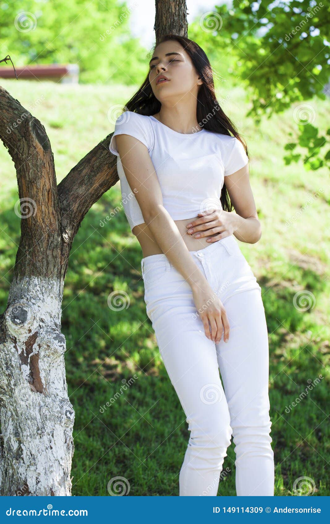 Beautiful Brunette Woman Posing Against Summer Park Bright Sunny