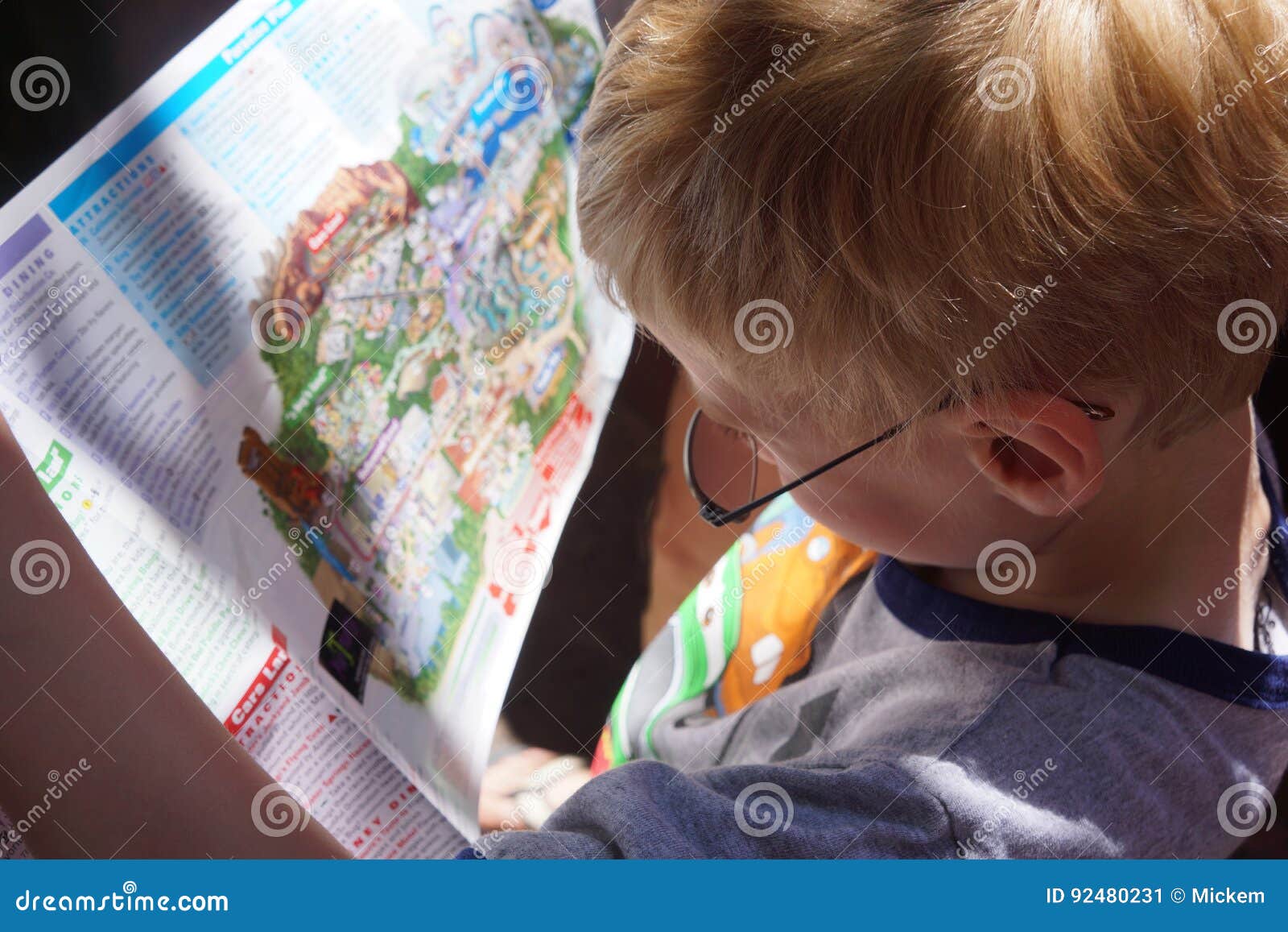 Young Boy Reading Map stock image. Image of cute, direction - 92480231