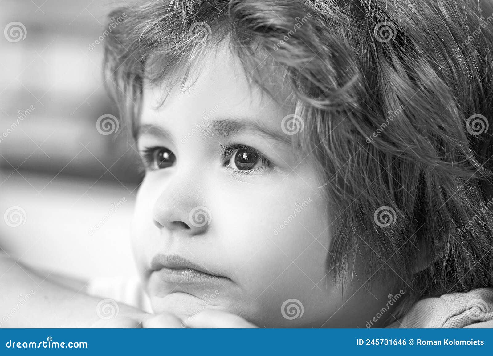 A Close Up of a Young Boy with a Serious Look of Concern. Stock Photo ...