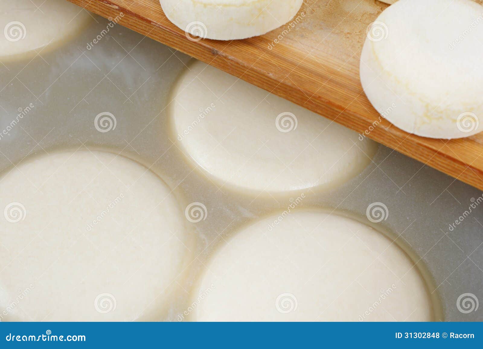 Close-up of Young Cheeses in the Salt Water Bath Stock Photo - Image of ...