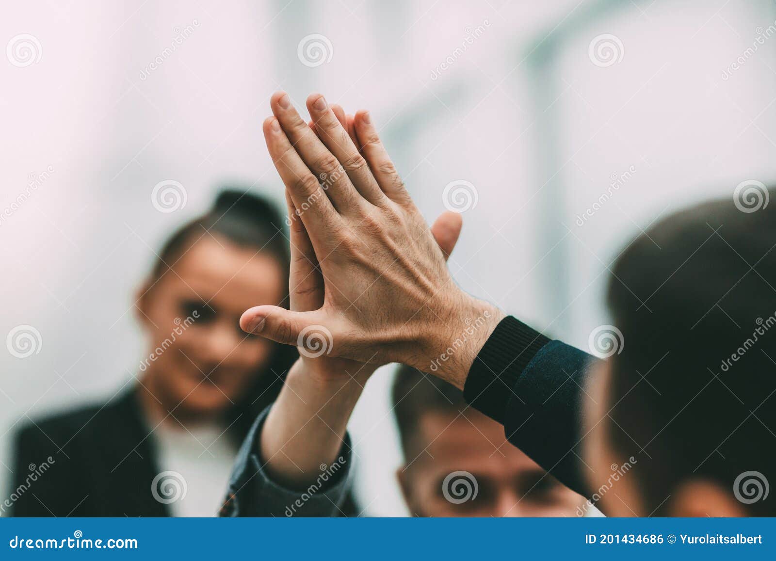 Close Up. Young Employees Giving Each Other a High Five Stock Photo ...