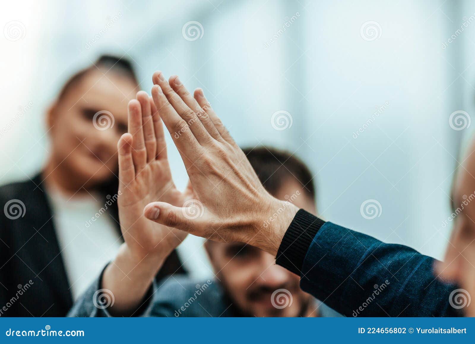 Close Up. Young Employees Giving Each Other a High Five Stock Photo ...
