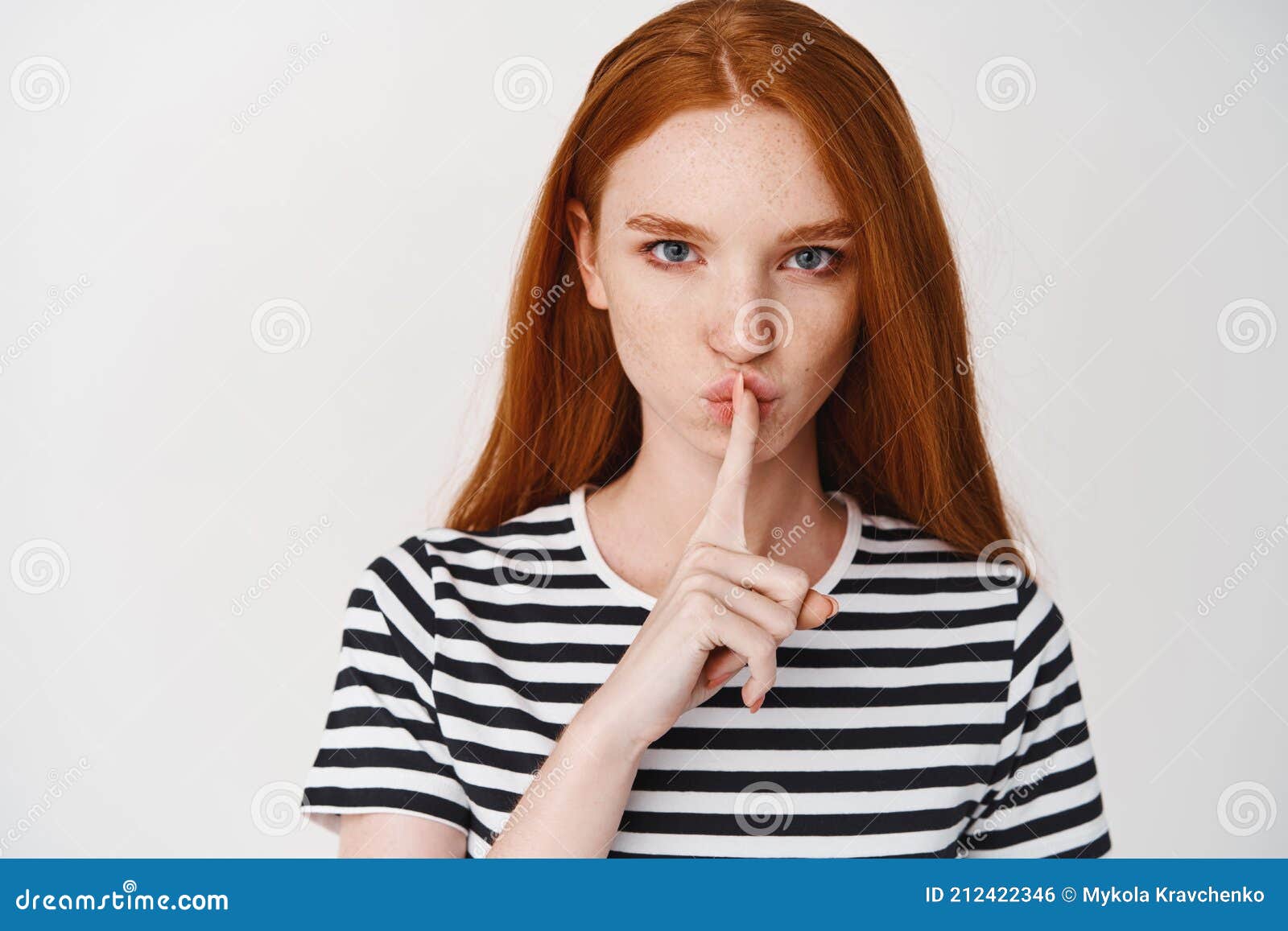 Close Up Of Young Ginger Girl With Serious Face Showing Taboo Sign