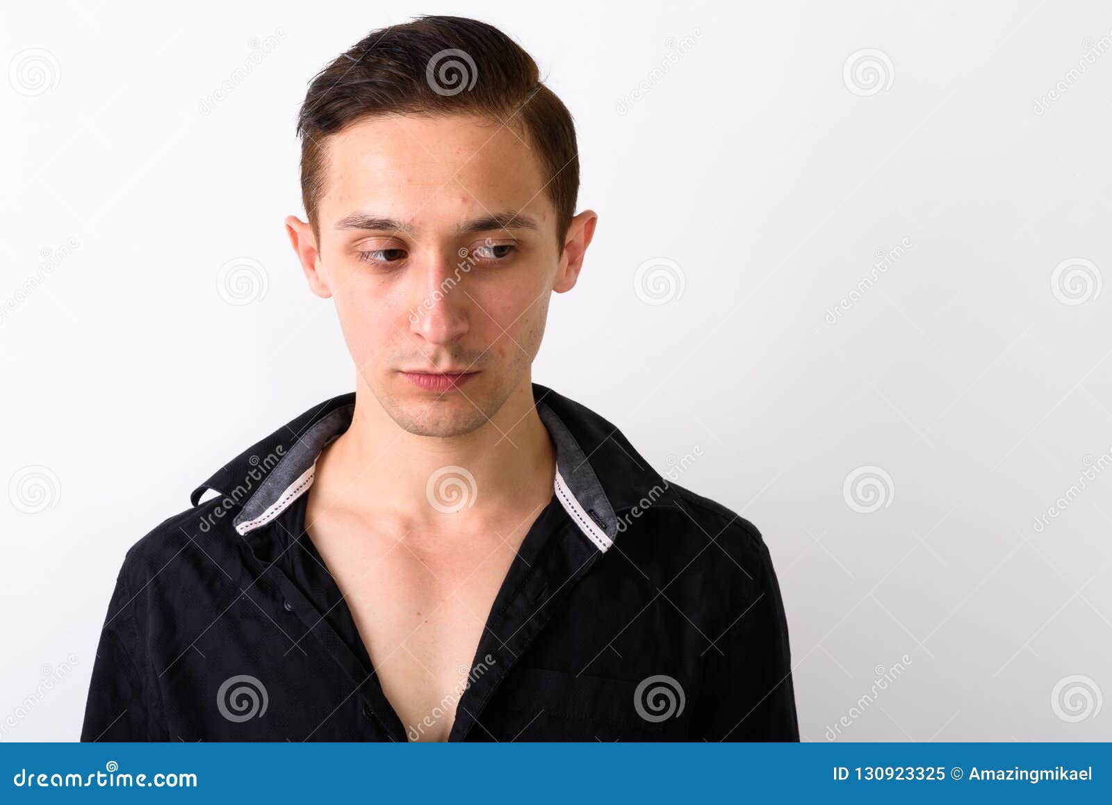 Close Up of Young Handsome Man Thinking while Looking Down with Stock ...