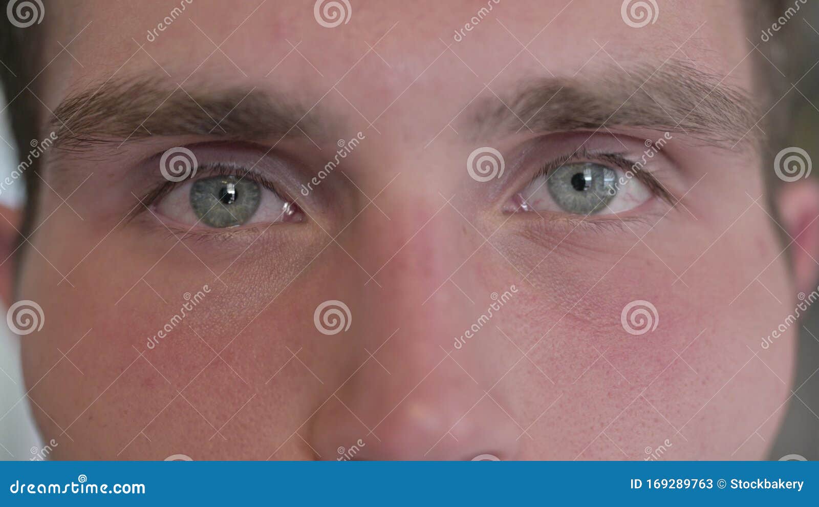 The Close Up of Young Man Blinking Eyes in Camera Stock Image - Image ...