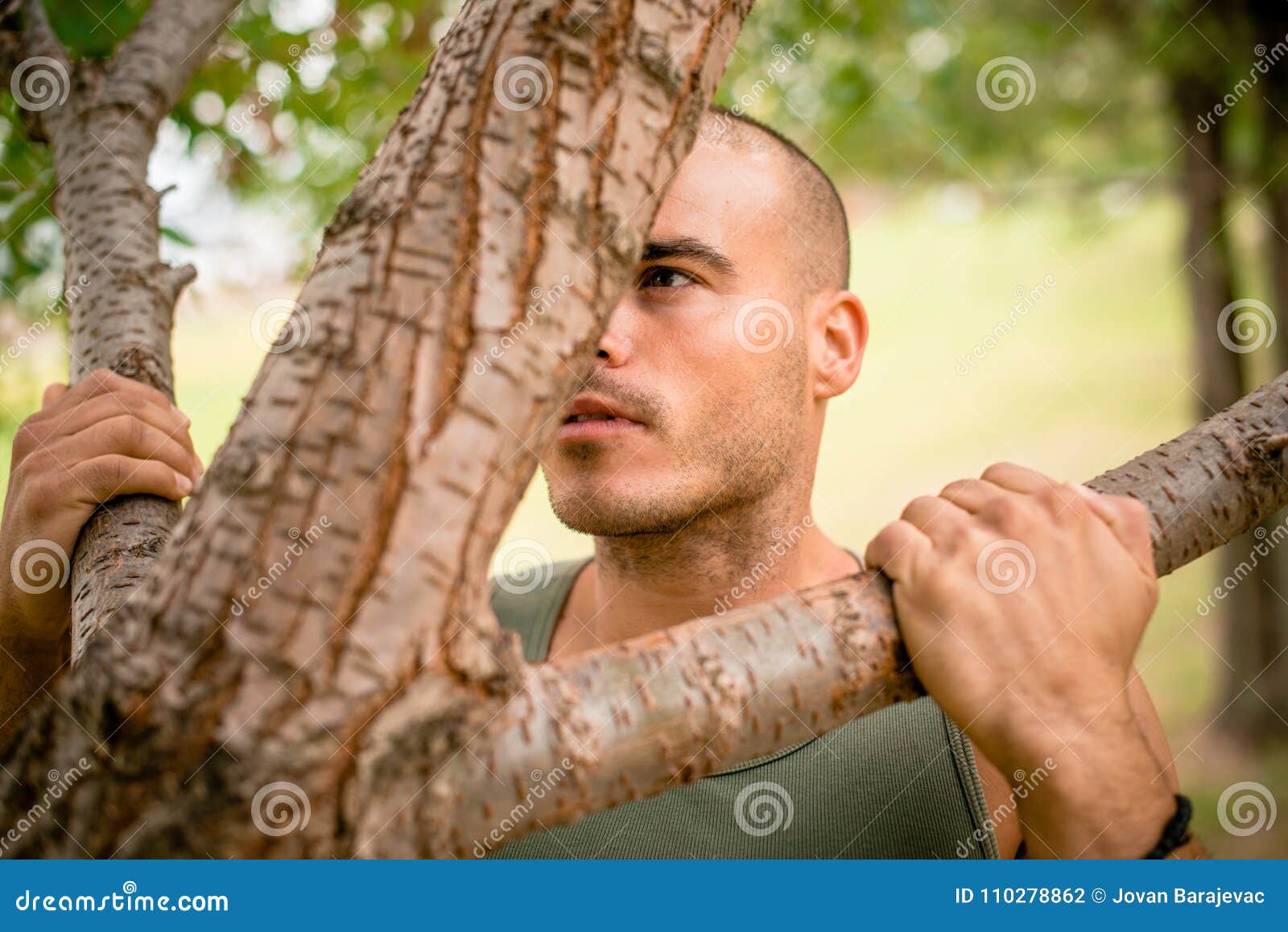 Close Up of Man Doing Pull Ups on Tree Stock Photo - Image of chin ...