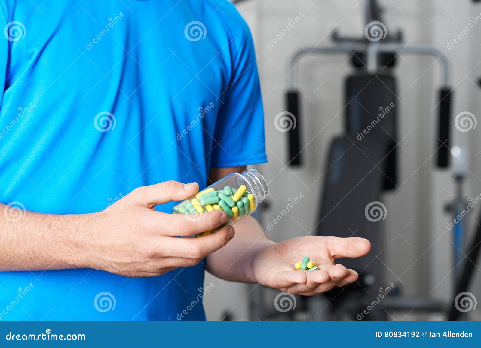 Close Up of Young Man in Gym Taking Tablets Stock Photo - Image of ...