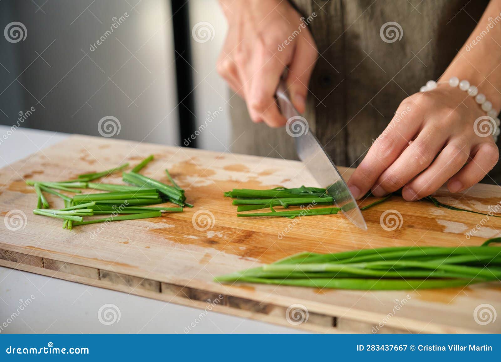 Close Up of Young Man Hands Cutting Chinese Chive at Kitchen. Stock ...