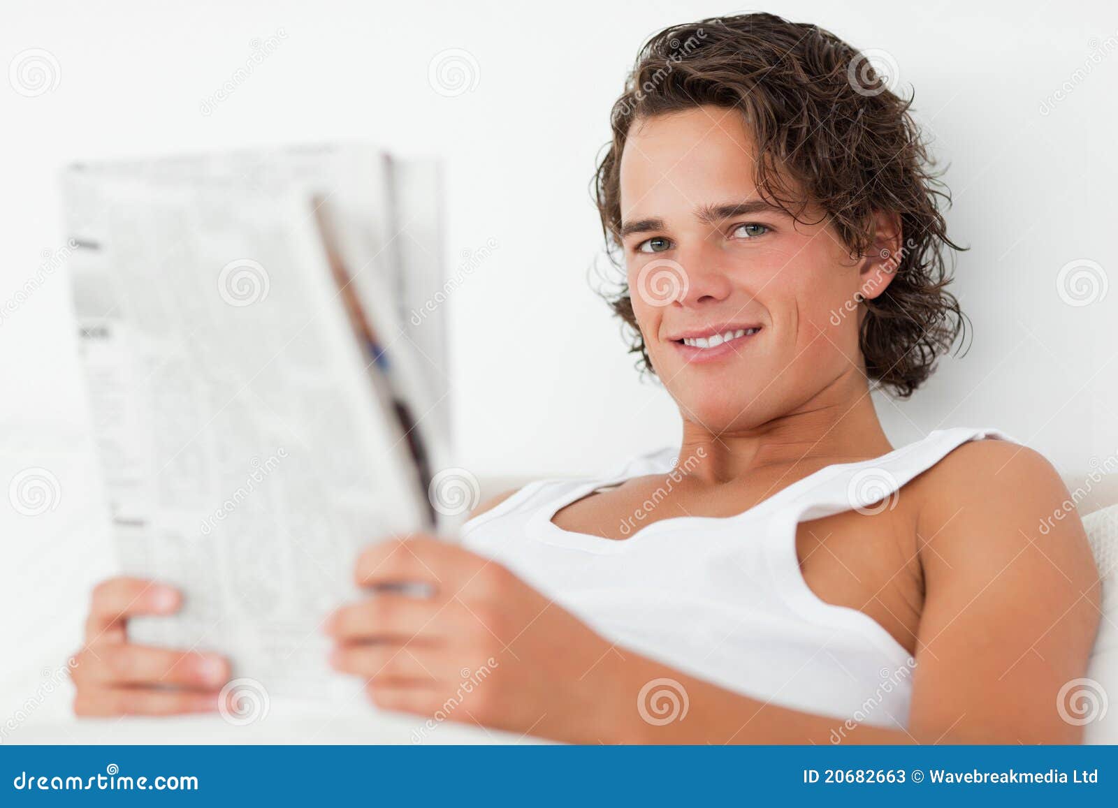 Close Up of a Young Man Holding a Newspaper Stock Image - Image of news ...