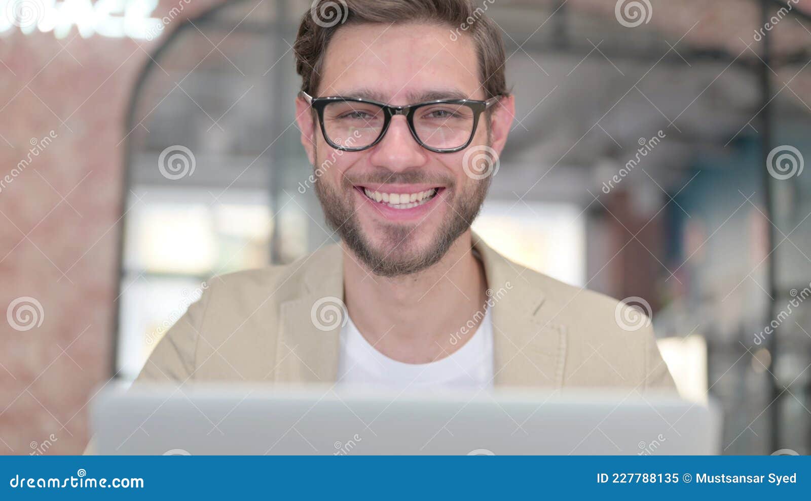 Close Up of Man with Laptop Smiling at Camera Stock Image - Image of ...