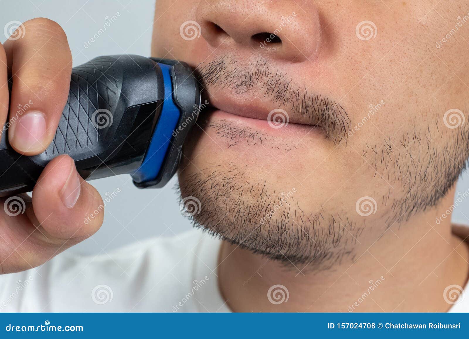 Close Up of a Young Man Shaving with Electric Razor Stock Photo - Image ...