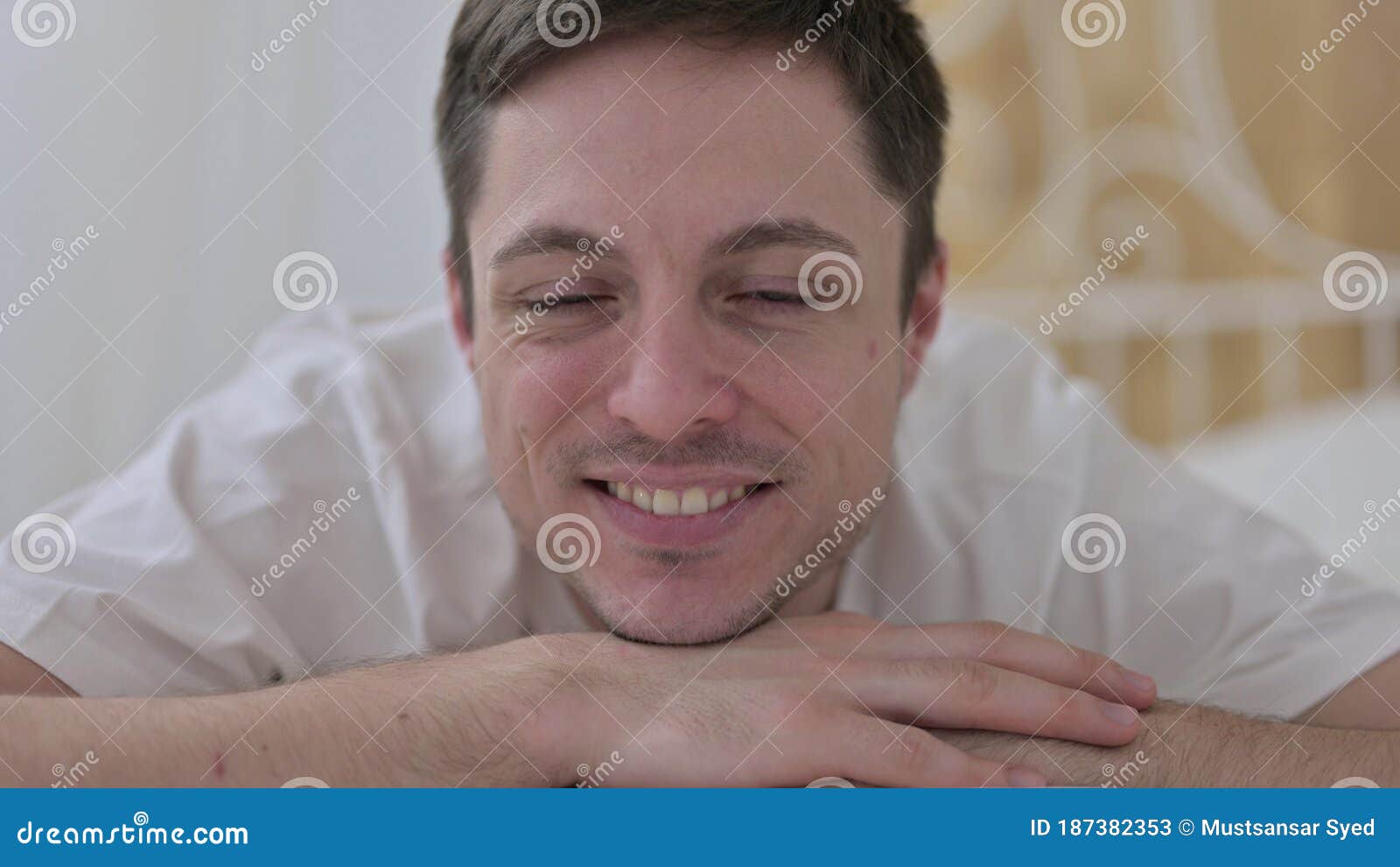 Close Up of Young Man Smiling at Camera in Bed Stock Image - Image of ...