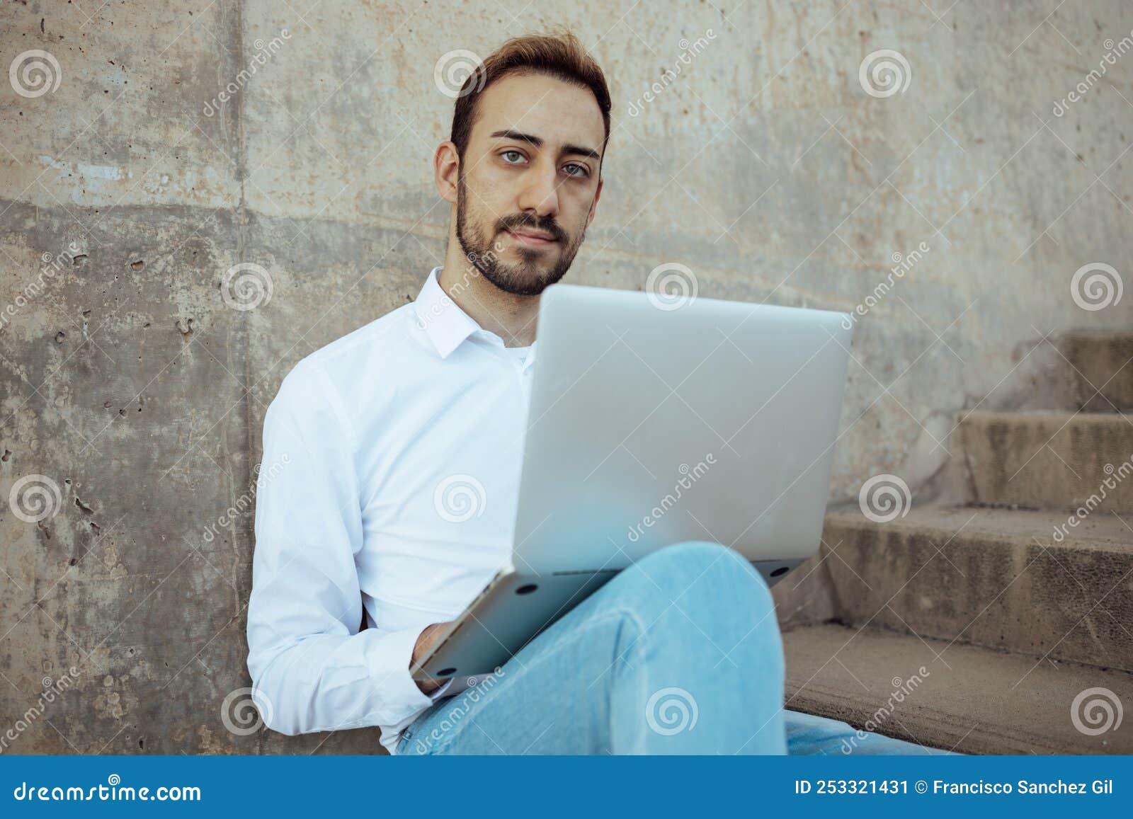 Close-up of Young Man Working with Computer Looking at the Camera Stock ...