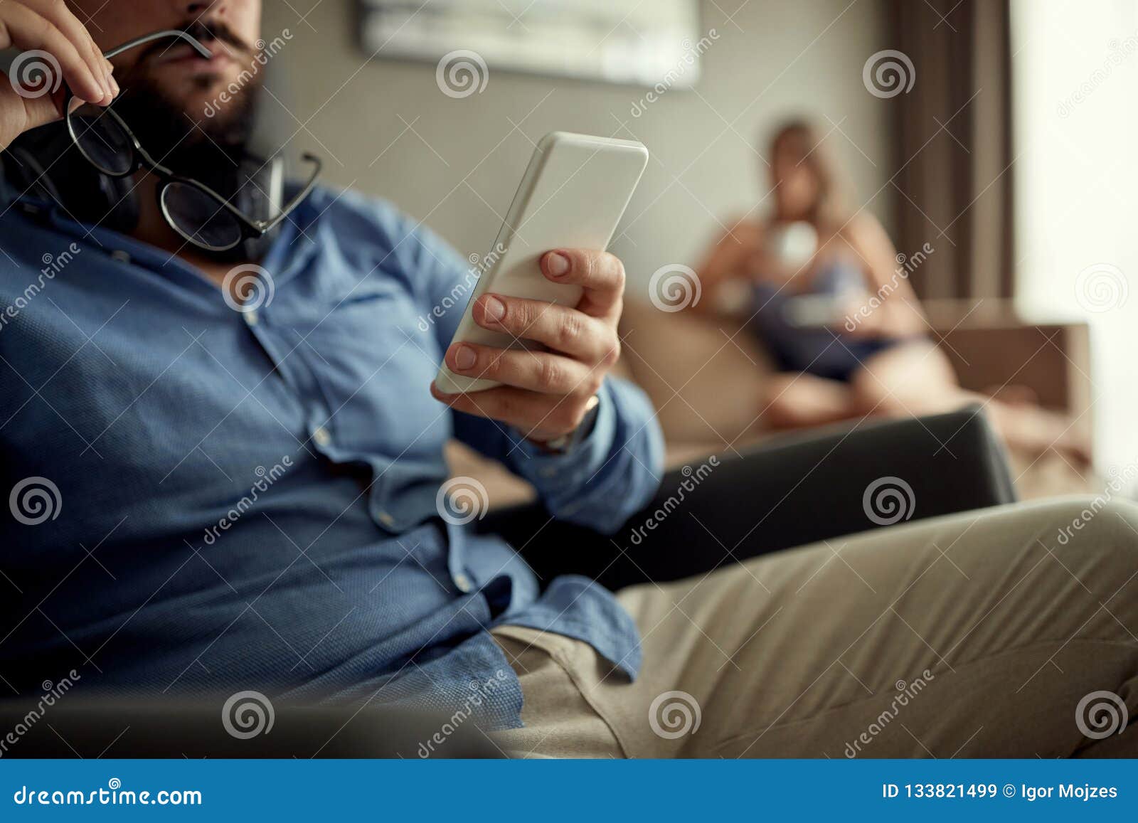 Close Up of Man Using a Smartphone while Resting at Home Stock Image ...