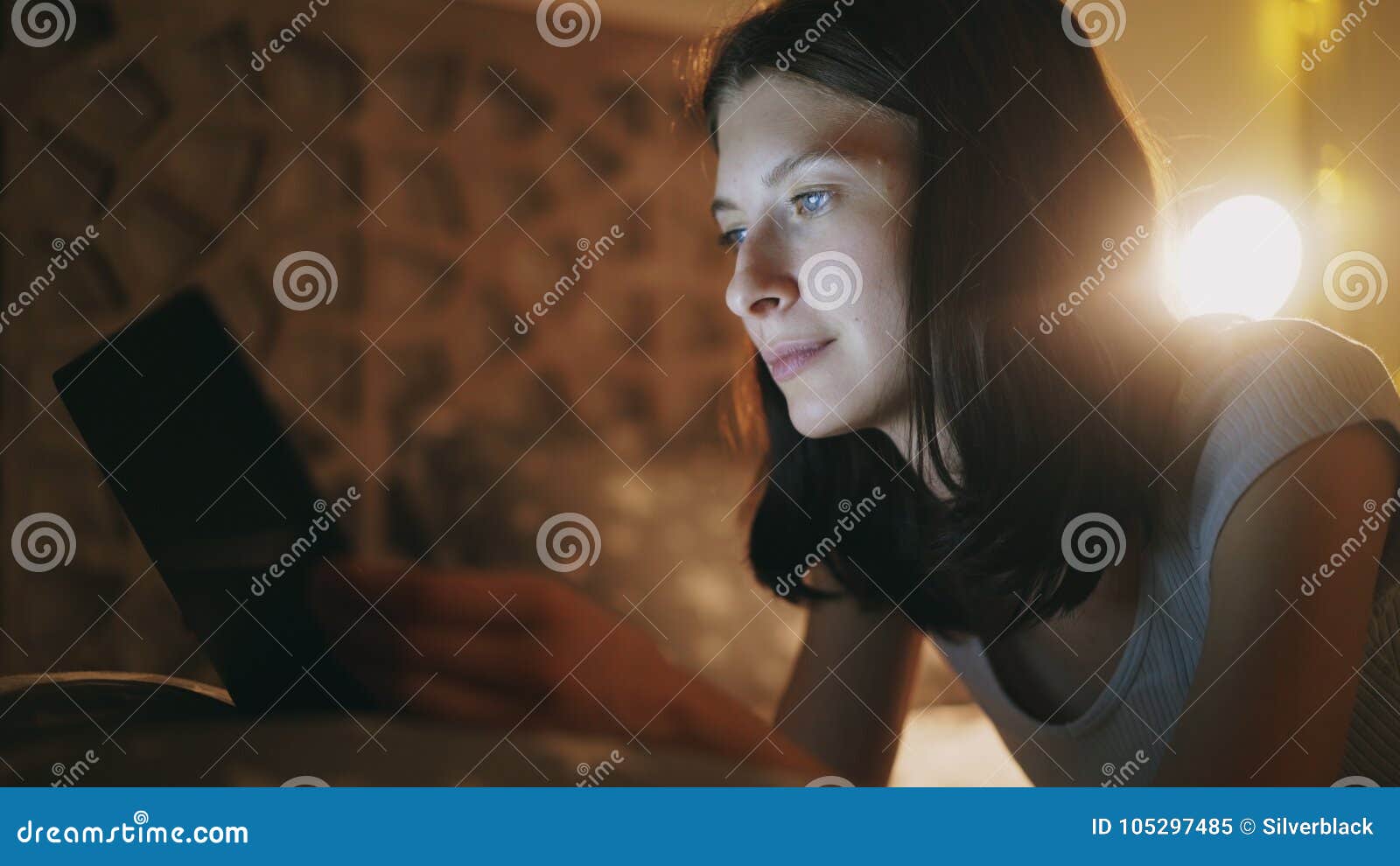 Close-up of Young Pretty Woman Using Tablet Computer at Night Time ...