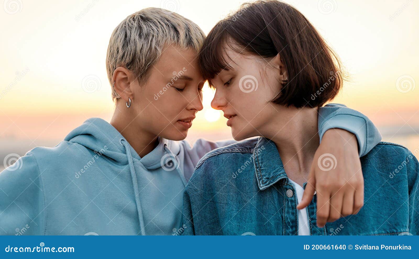 Close Up Of Young Sensual Lesbian Couple Going To Kiss Two Women